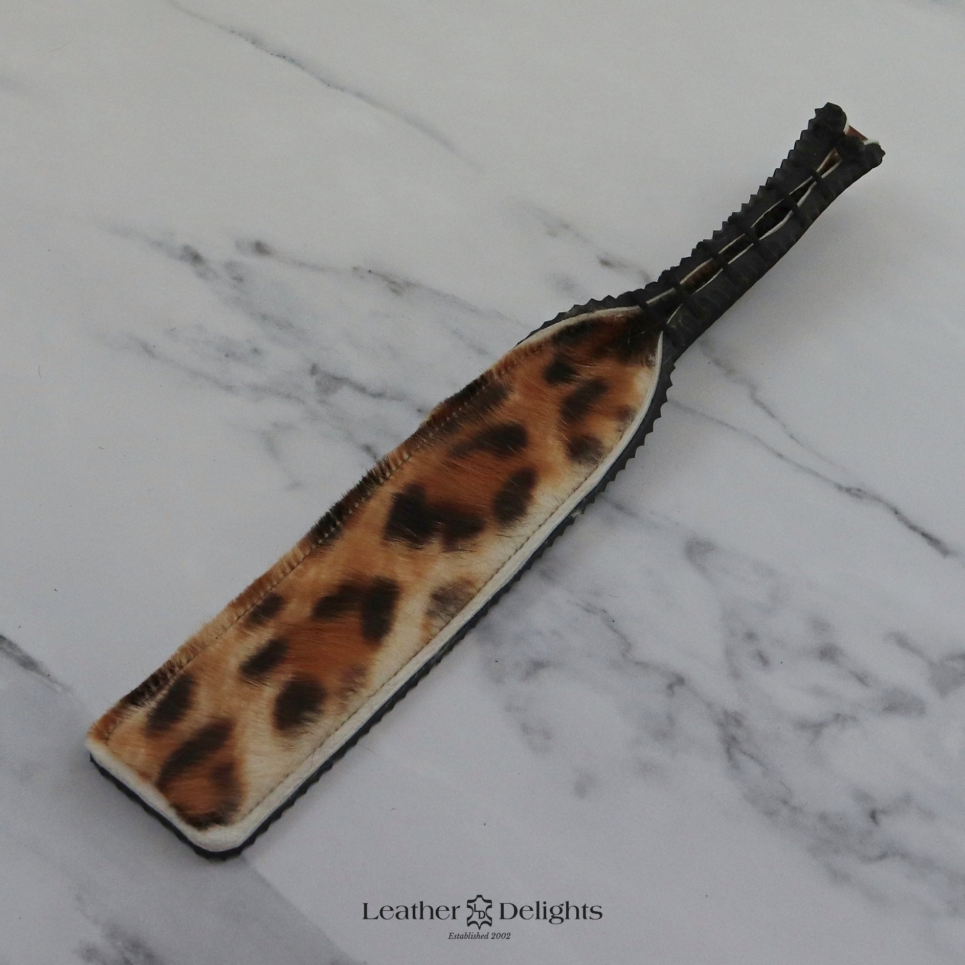 Double Cheek Slapper - Animal Print Sheepskin & Black Ripple Rubber ...